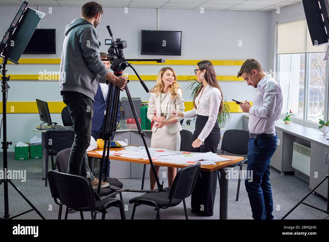 Film director discussing movie plan with the actors in the office scene ...