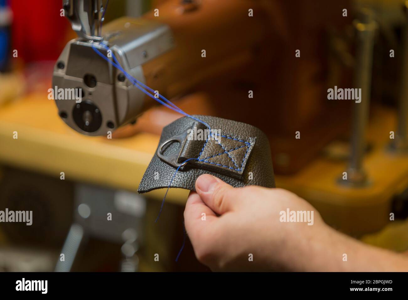 Showing a box stitch pattern on black leather Stock Photo - Alamy