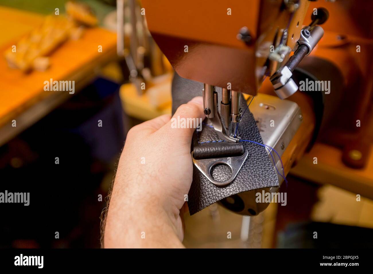 Creating a box stitch pattern on black leather Stock Photo - Alamy