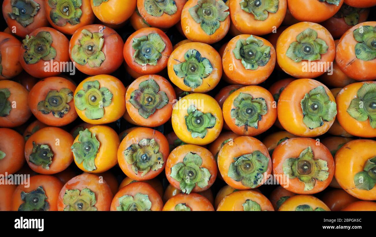 Pile of persimmons hi-res stock photography and images - Alamy
