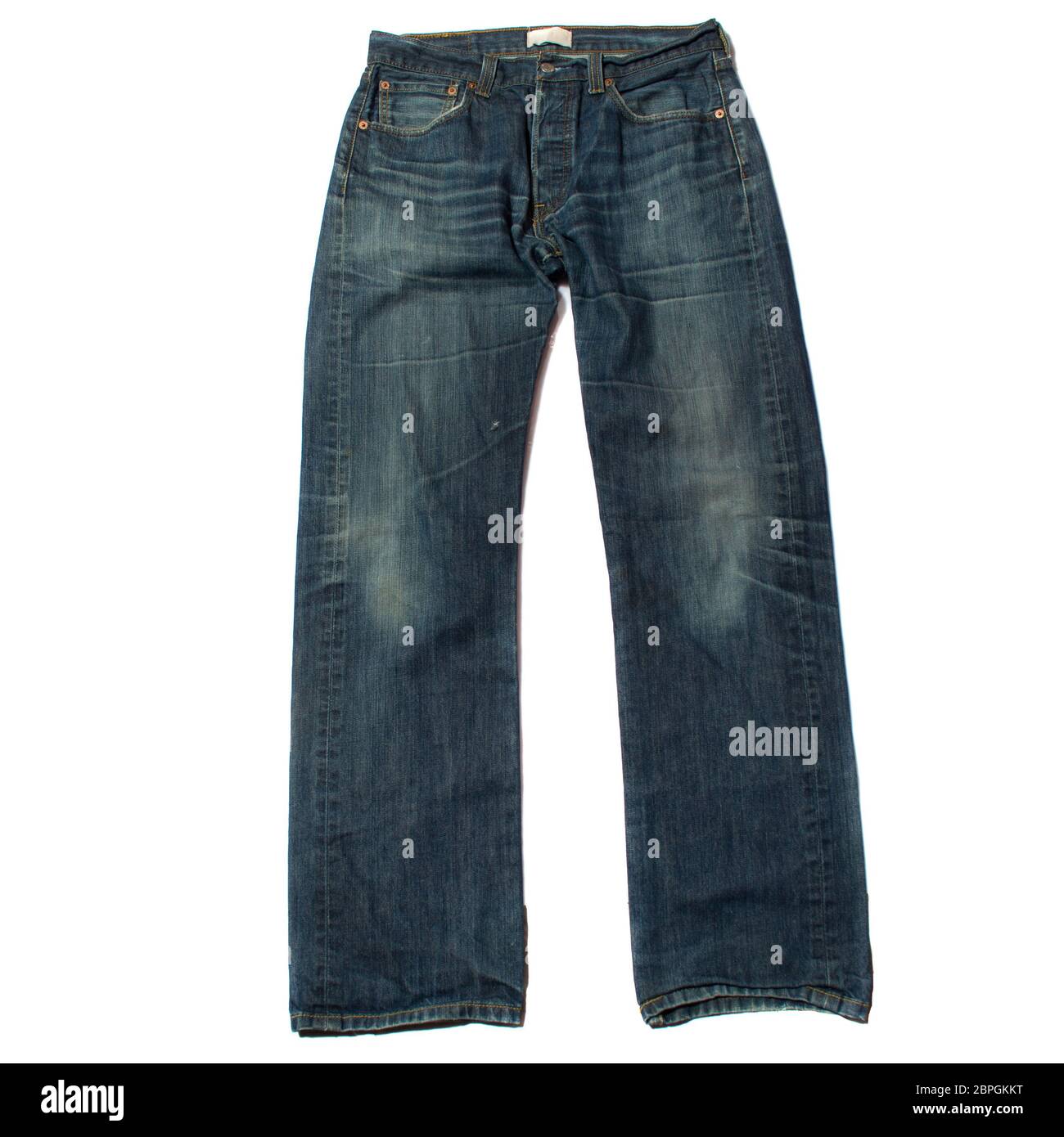 Classic vintage blue jeans on white background Stock Photo - Alamy