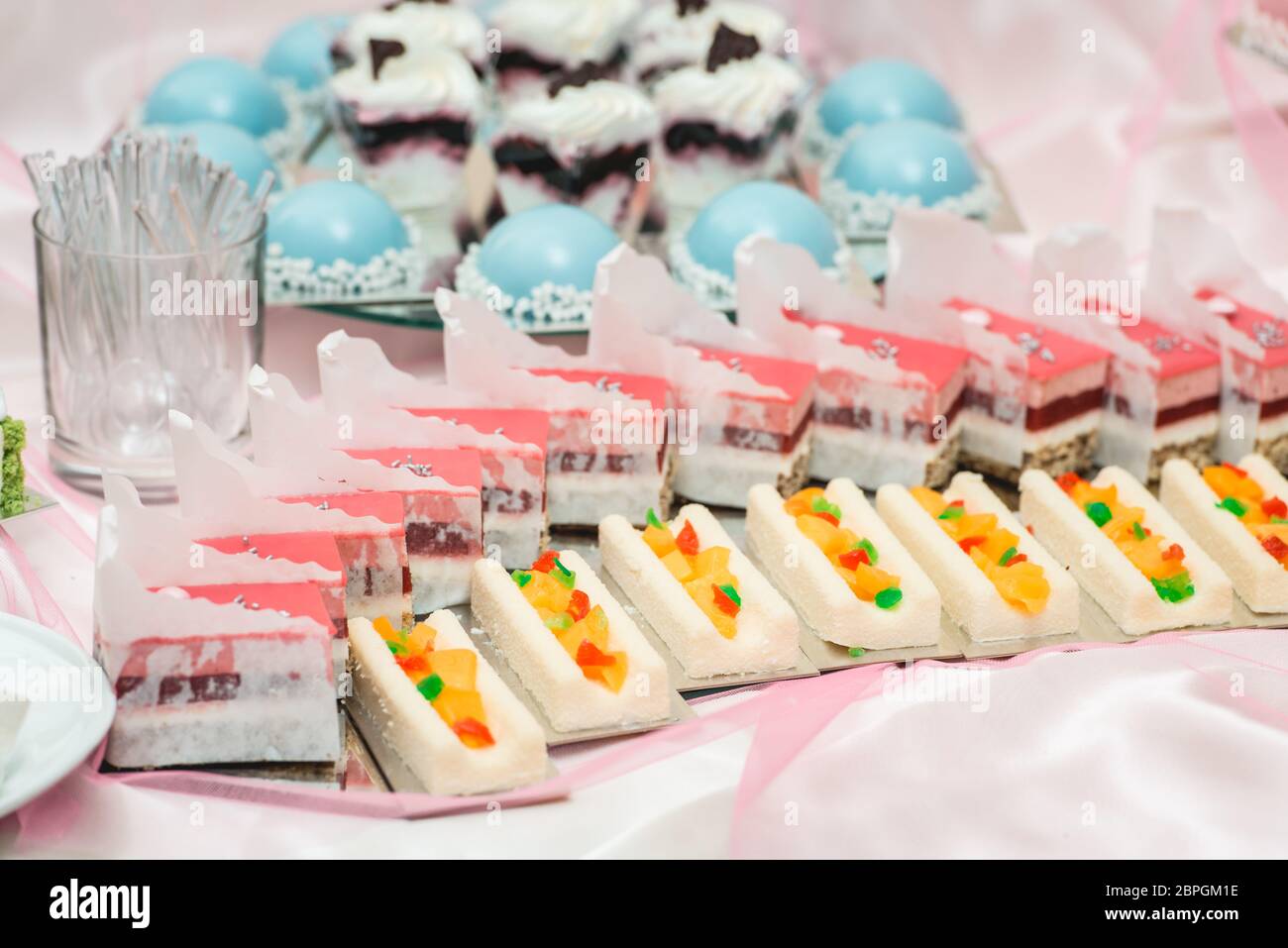 Set of different cakes sweets and desserts arranged on one plate. Party ...