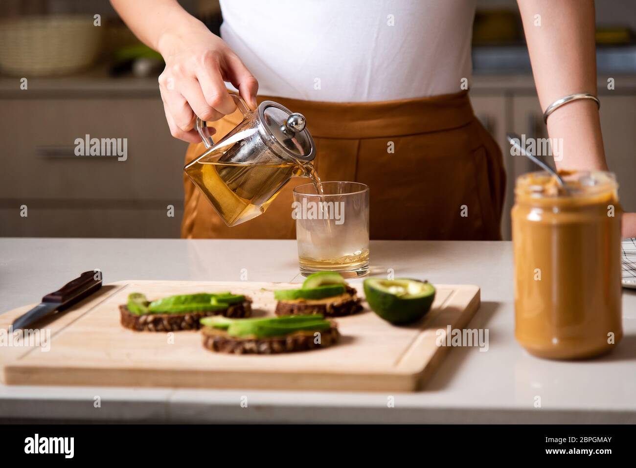Woman making healthy green breakfast hi-res stock photography and ...