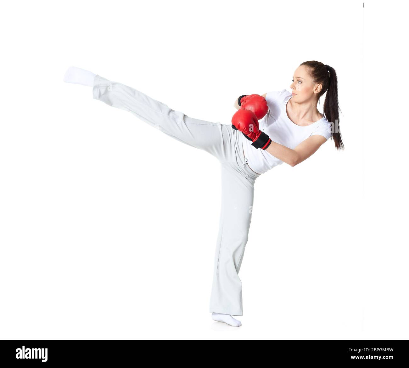 Sporty young woman in red fighting gloves on a white background Stock ...