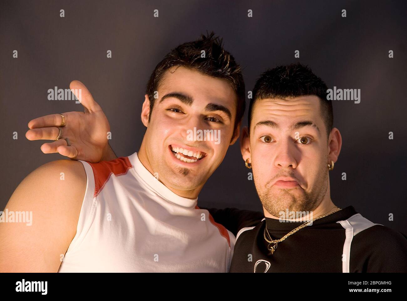 Two young men pulling faces. Close view Stock Photo - Alamy