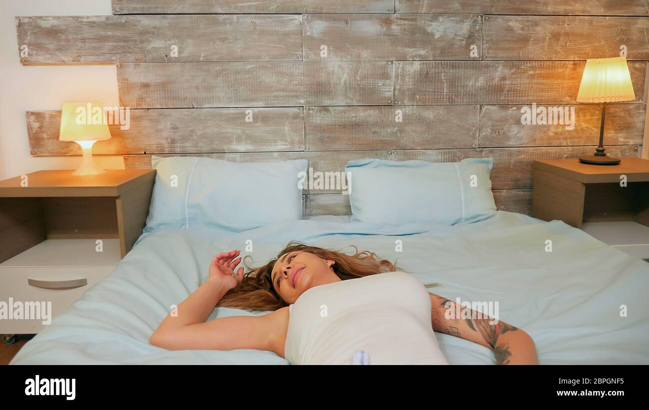 Woman falling on bed hi-res stock photography and images - Alamy