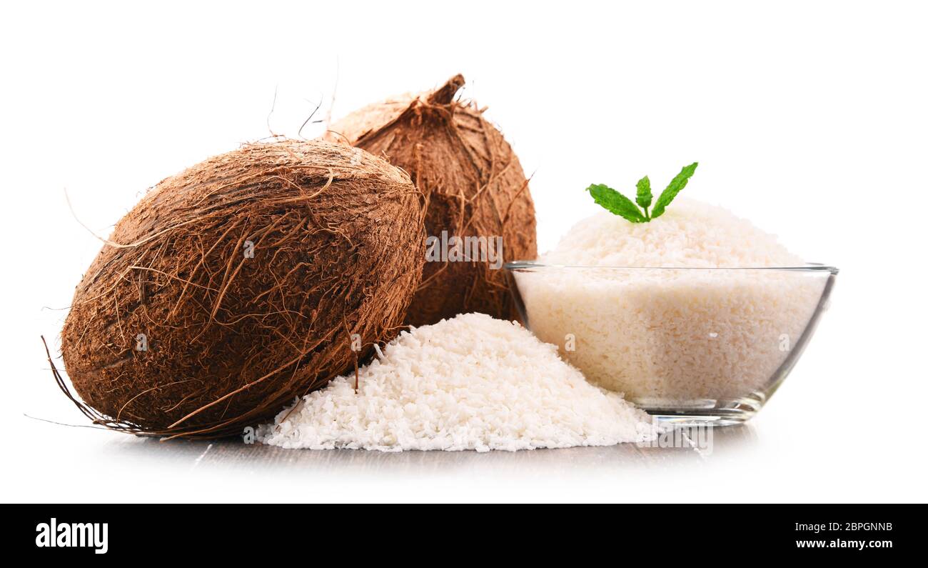 Composition with shredded coconut and shells isolated on white ...