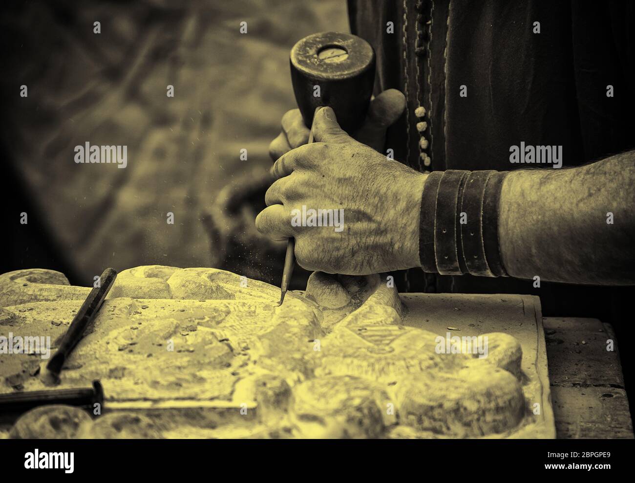 Carving stone in a traditional way, craftsmanship detail, shaping the ...