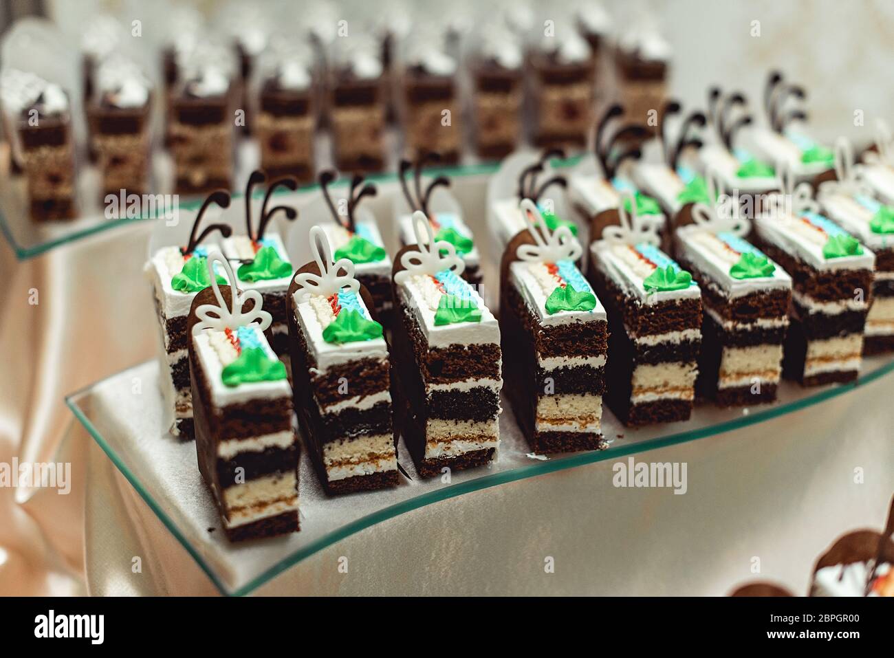 Rows of different dessert cakes on the candy bar Stock Photo - Alamy