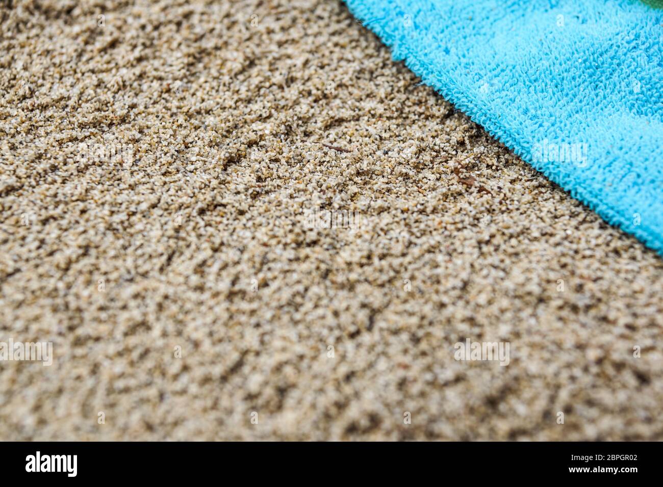 Colorful summer beachwear . towel on sand beach Stock Photo - Alamy