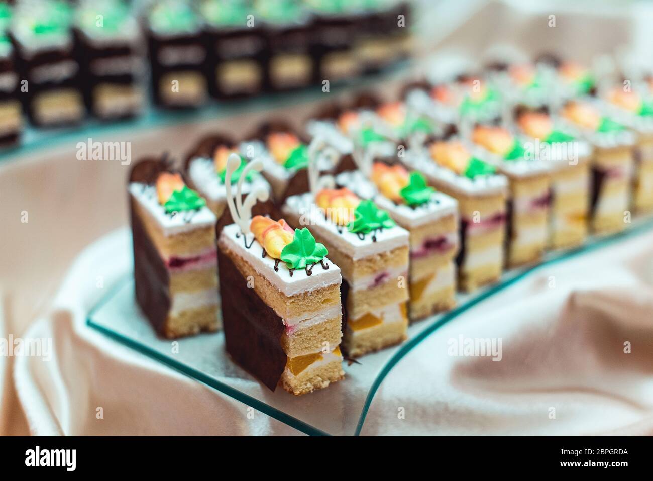 Rows of different dessert cakes on the candy bar Stock Photo - Alamy