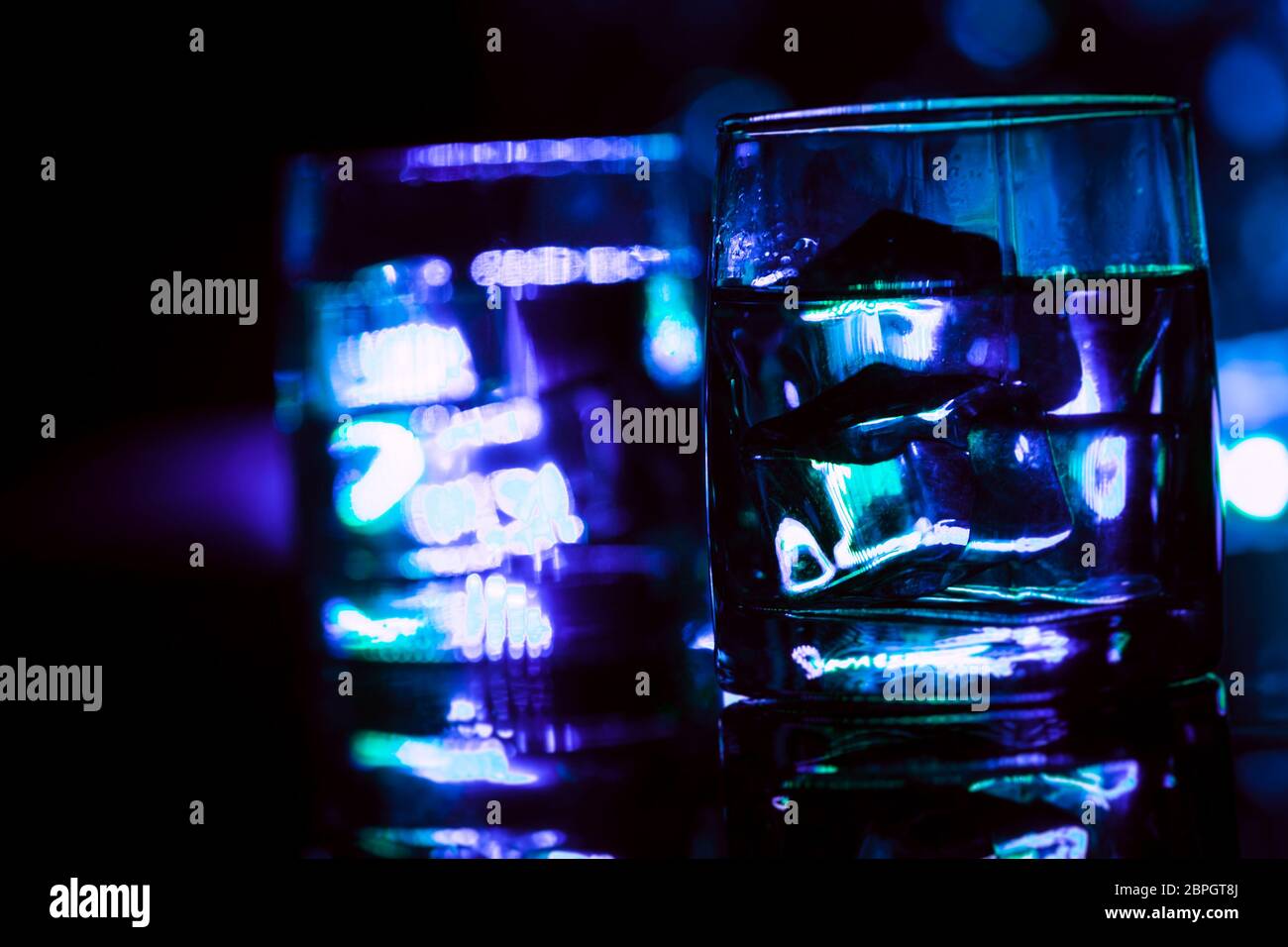colored lighting of glasses in the night club bar Stock Photo - Alamy