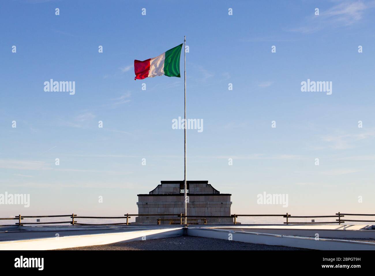 Italian flag on blue sky from first world war memorial in "Monte Grappa ...