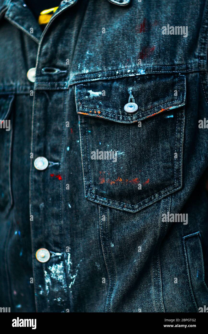 Denim jacket in paint stains close up Stock Photo - Alamy