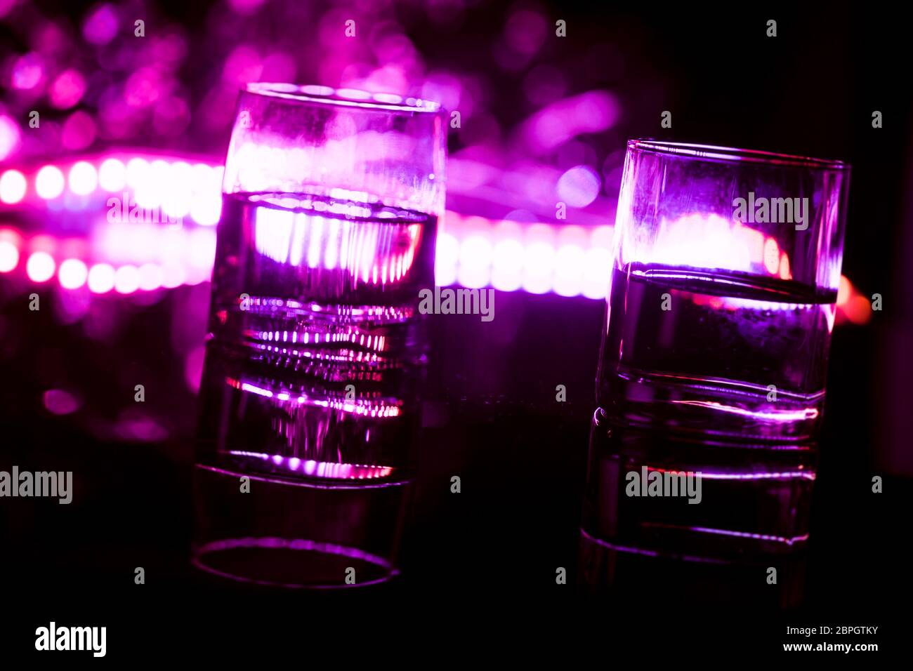 colored lighting of glasses in the night club bar Stock Photo - Alamy
