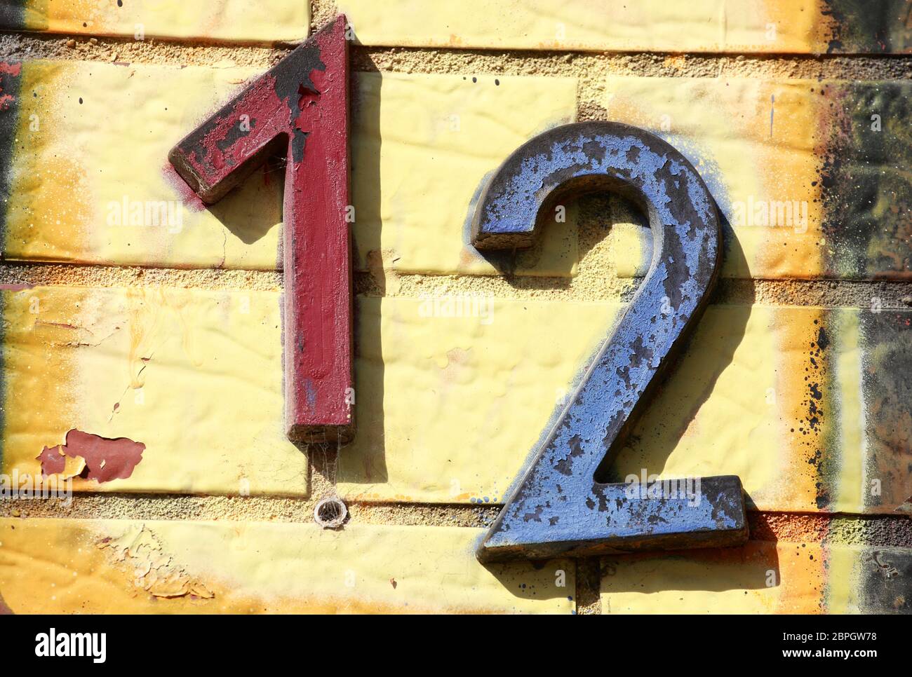 Old colorful house number plate number twelve on a house wall, Germany ...