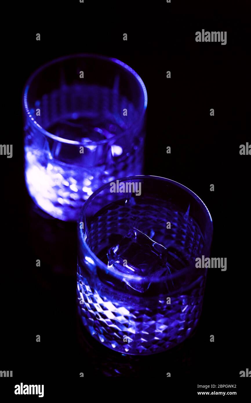bar colored lights with glasses of alcohol Stock Photo - Alamy