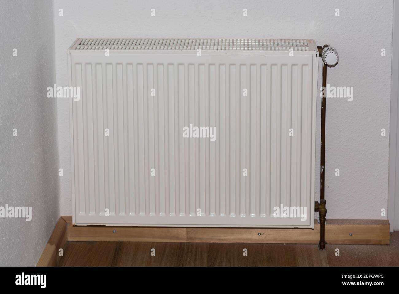 Old panel radiators in a renovated room Stock Photo - Alamy