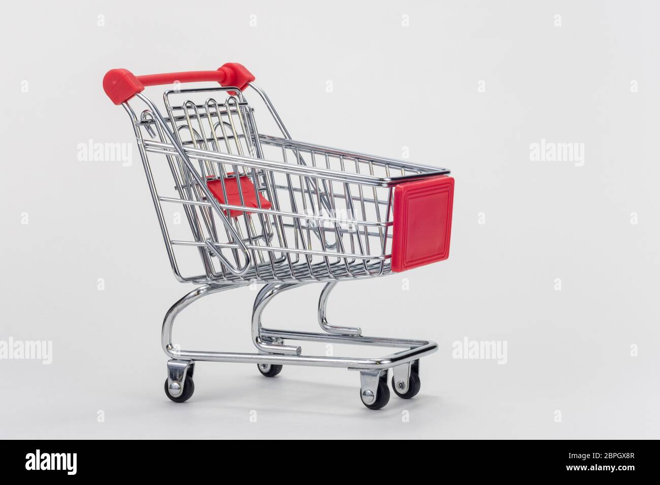 Empty grocery cart on white background Stock Photo - Alamy