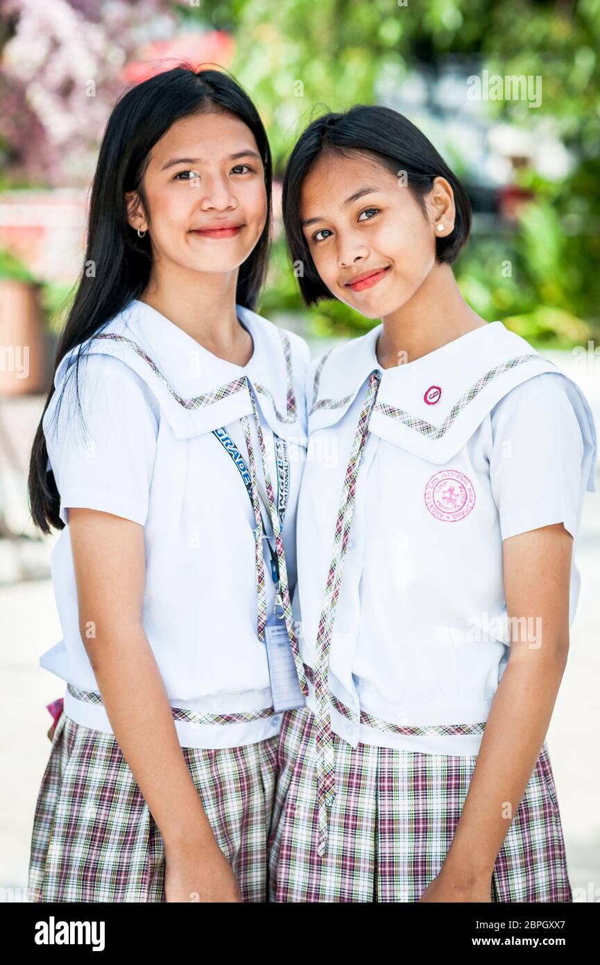 Playful Filipino school children pose in a park in Angeles City, The ...