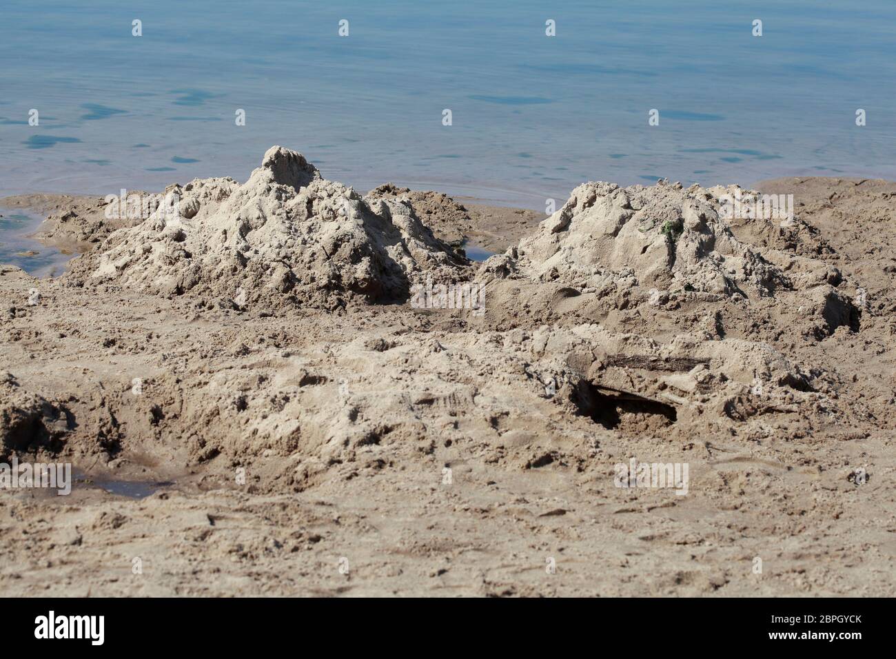 Sand castle, sandy beach, body of water, Germany, Europe Stock Photo ...