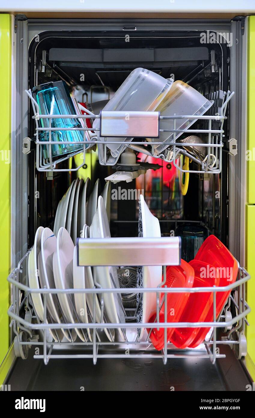 Front view of fully loaded dishwasher with washed clean dishes Stock ...