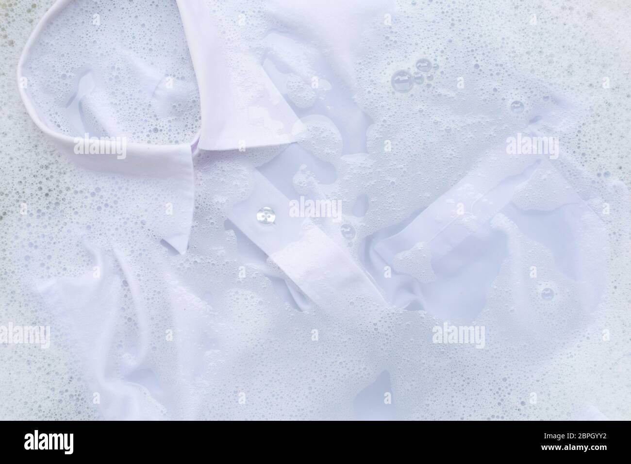 Soak a cloth before washing, white shirt Stock Photo - Alamy