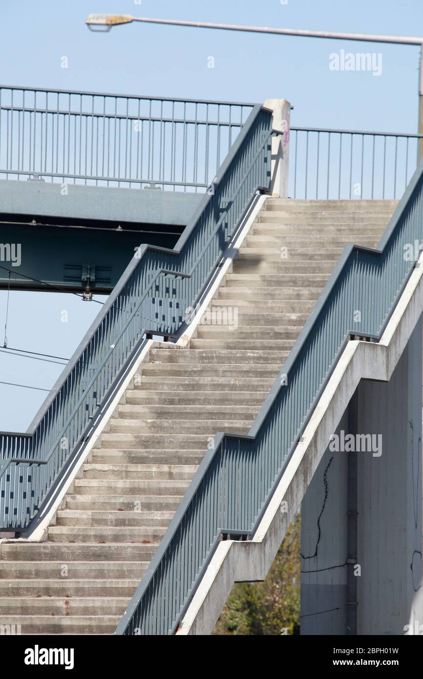 Concrete stairs and banisters on a pedestrian bridge, Germany, Europe ...
