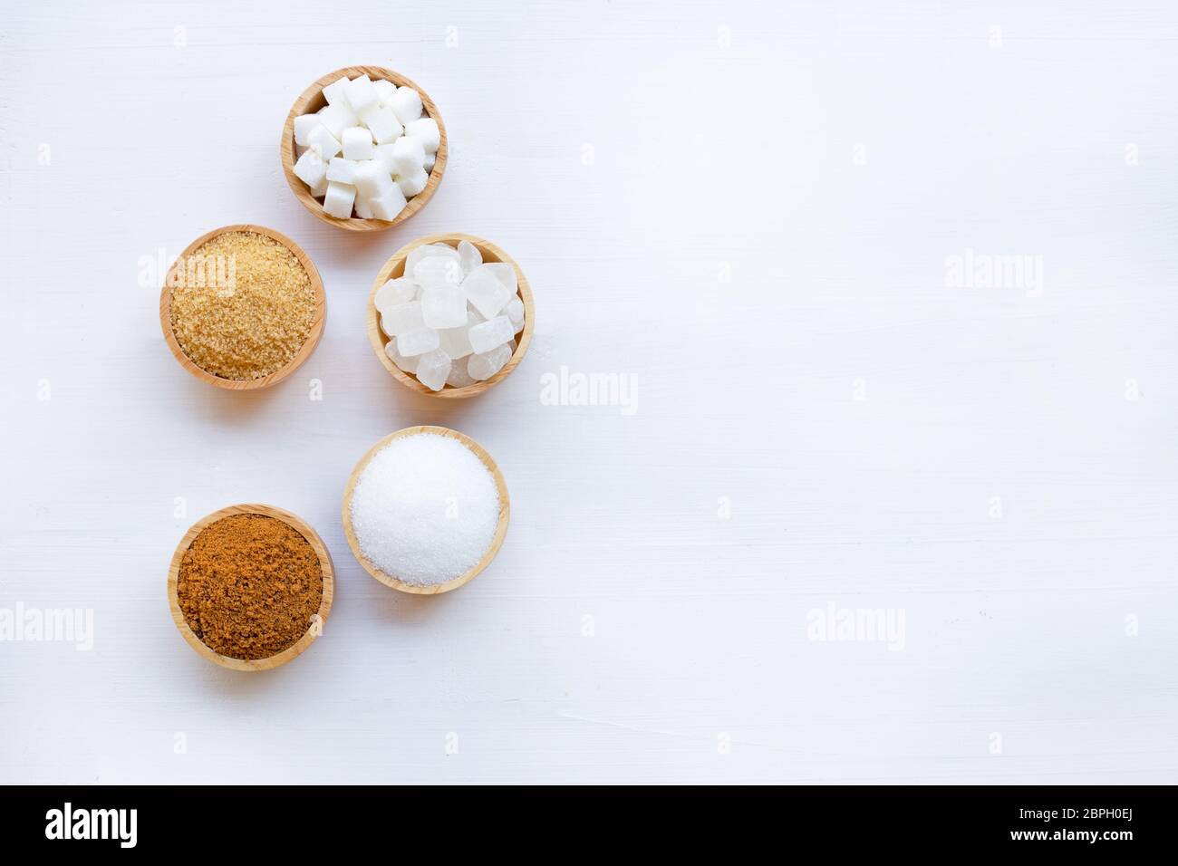 Various types of sugar on white wooden background Stock Photo - Alamy
