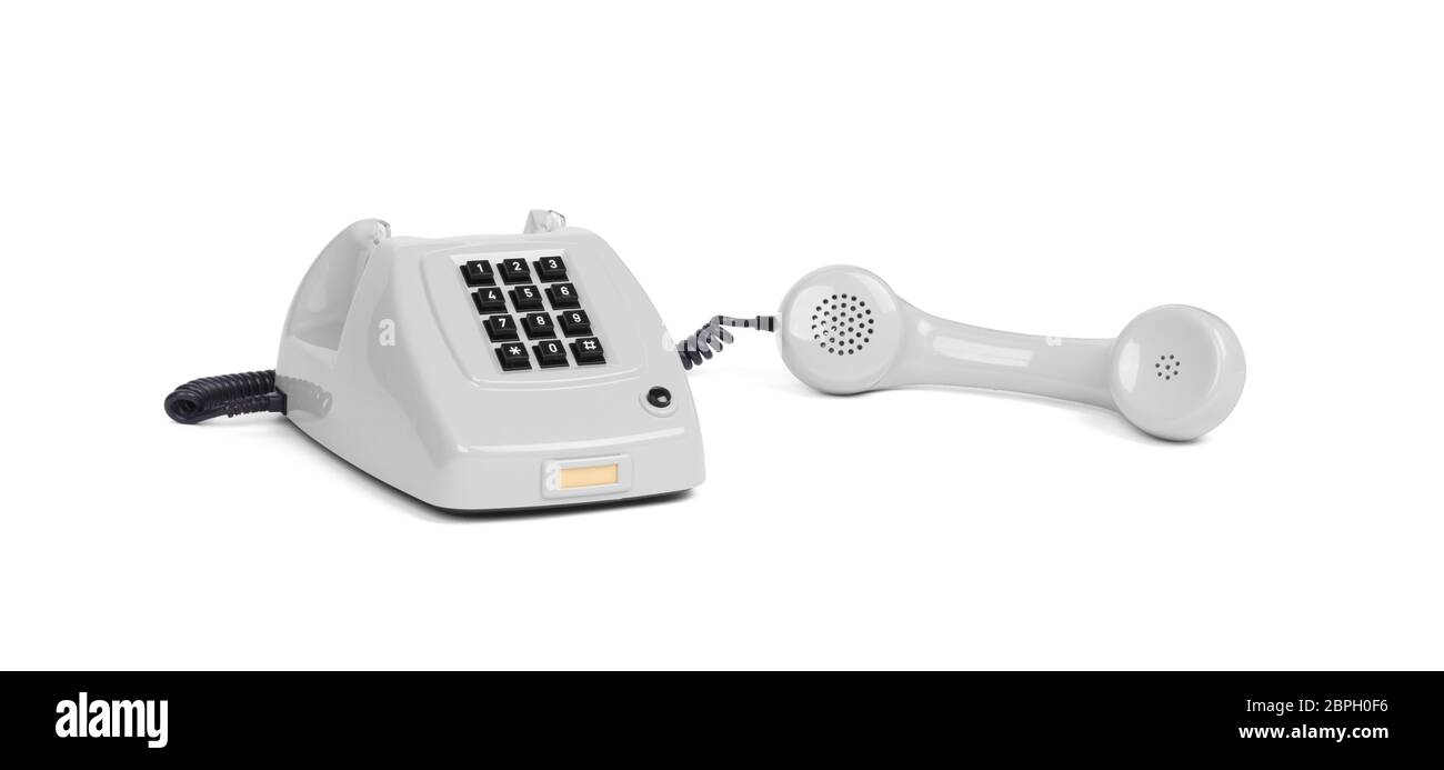 Vintage grey telephone with a white background Stock Photo - Alamy