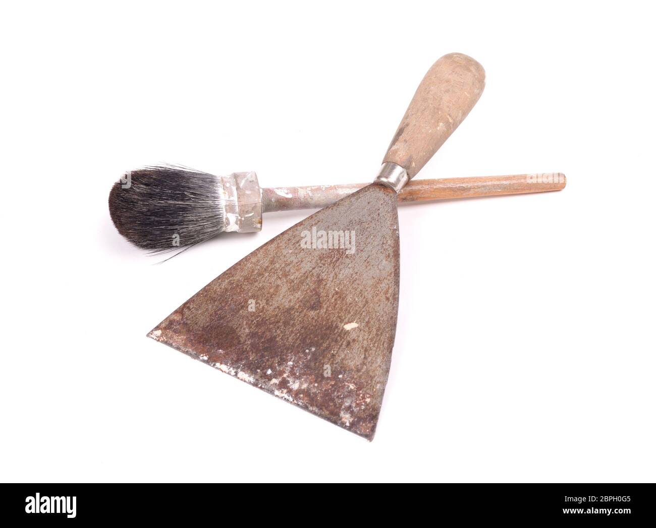 Old paintbrush with a putty knife, isolated on a white background Stock ...