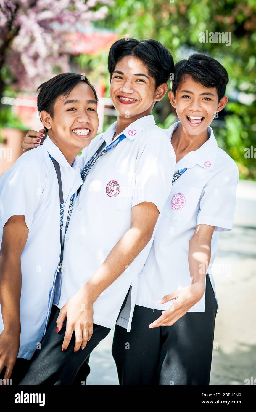 Playful Filipino school children pose in a park in Angeles City, The ...