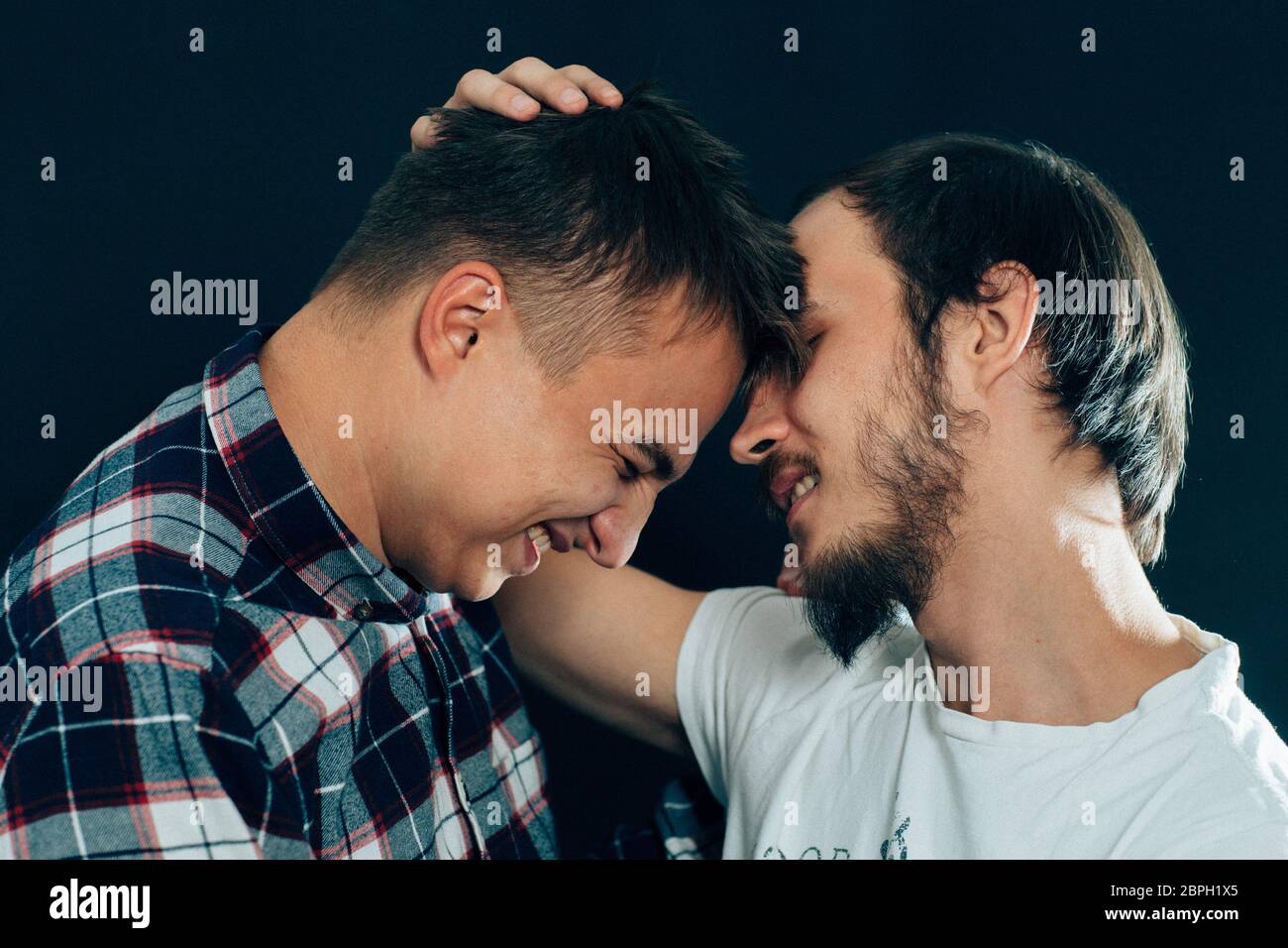 Guys hugging hi-res stock photography and images - Alamy