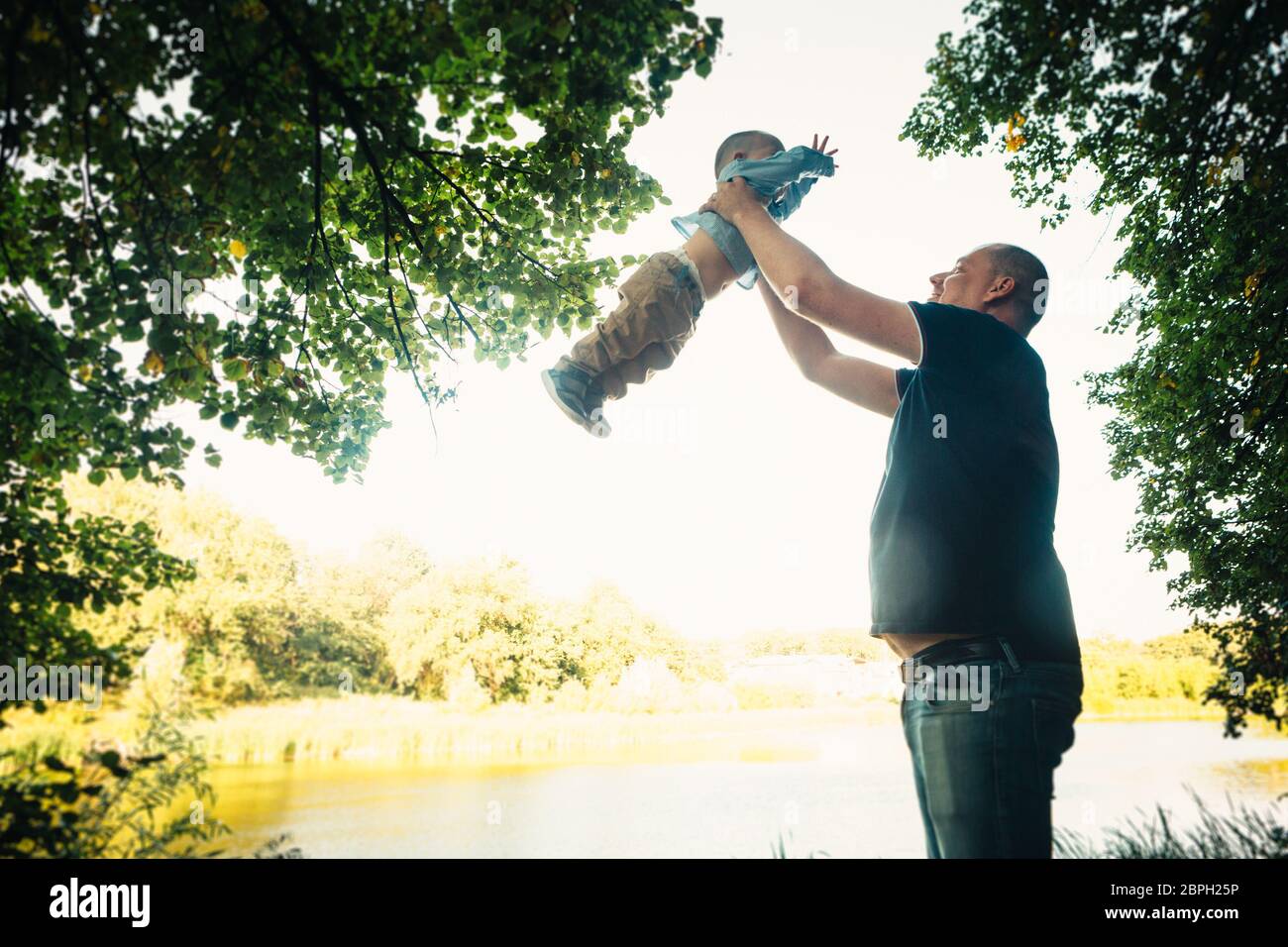 happy dad and baby on nature background Stock Photo - Alamy