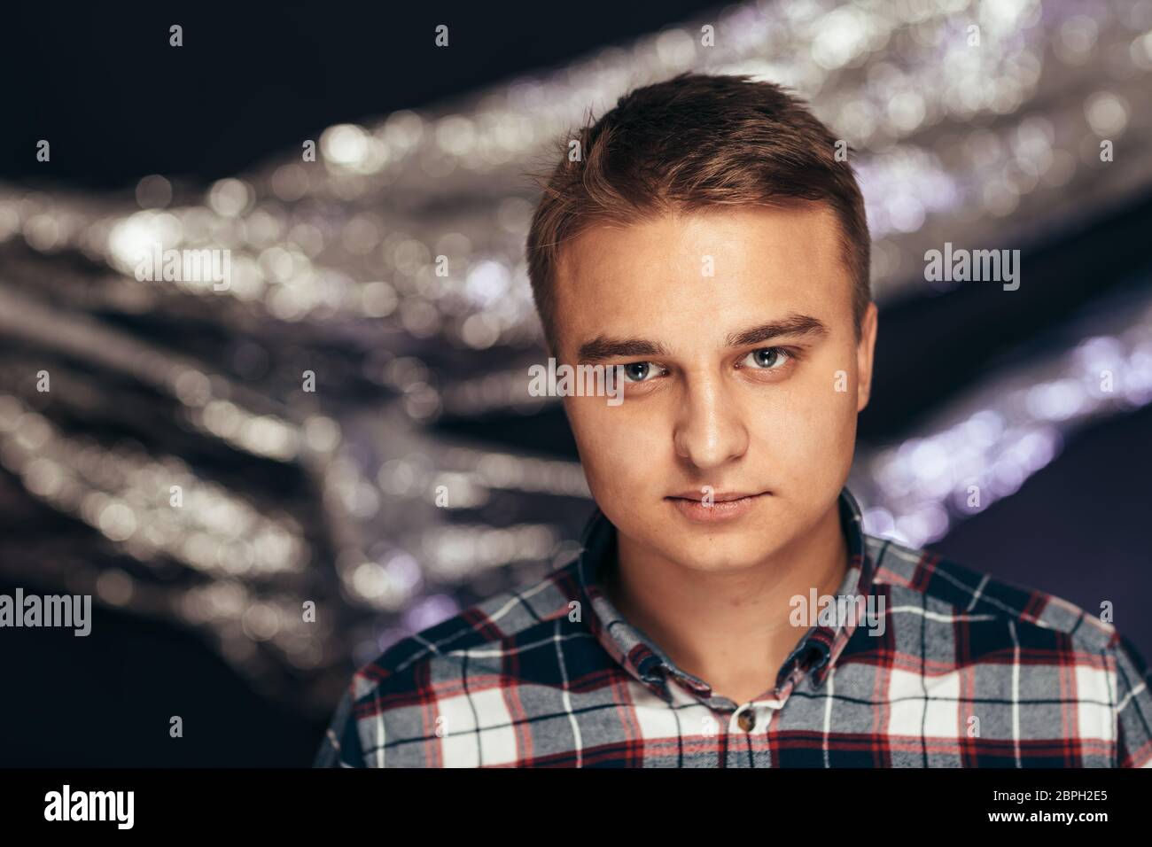 portrait of a young man on a blurred background Stock Photo - Alamy