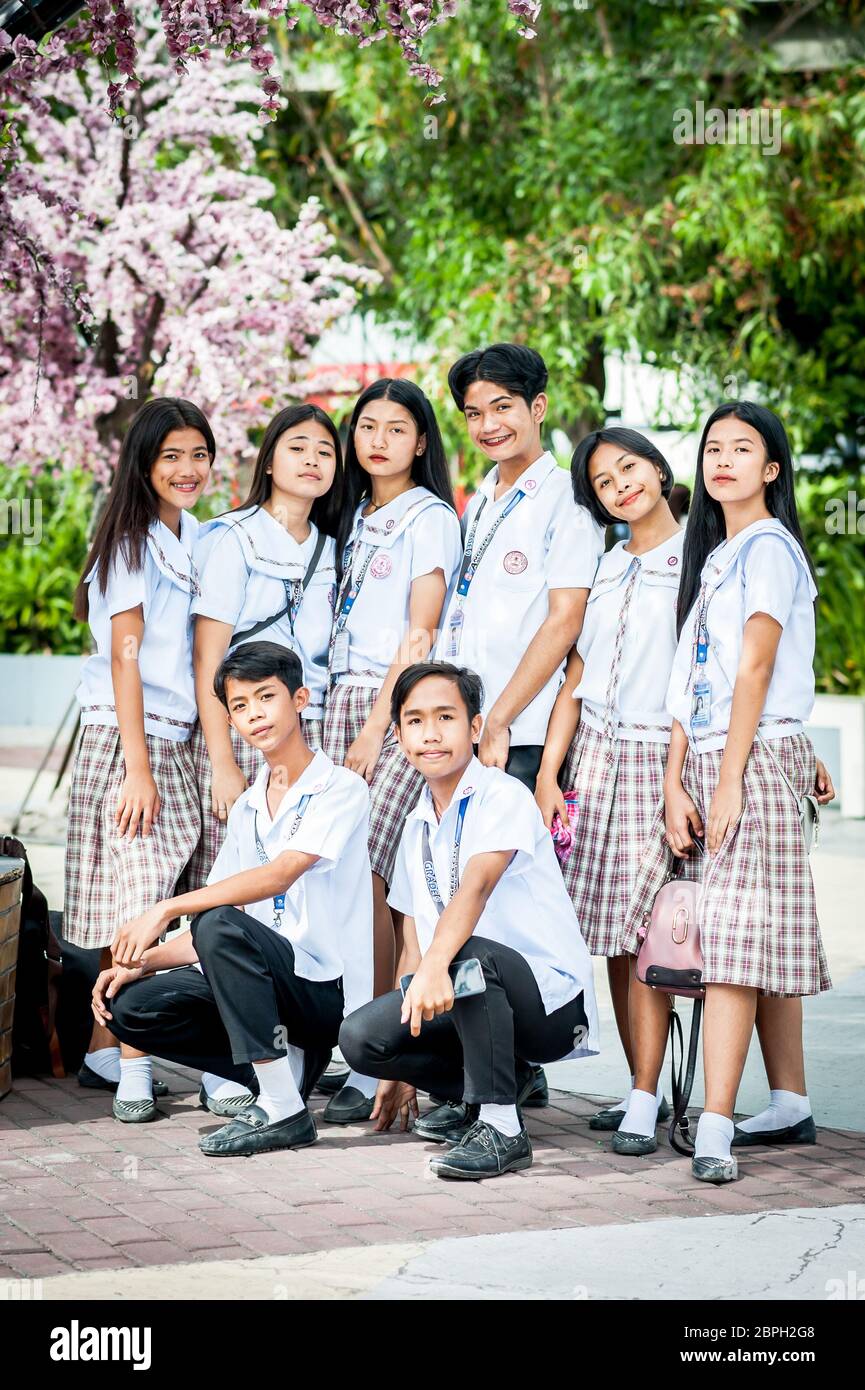 Playful Filipino school children pose in a park in Angeles City, The ...