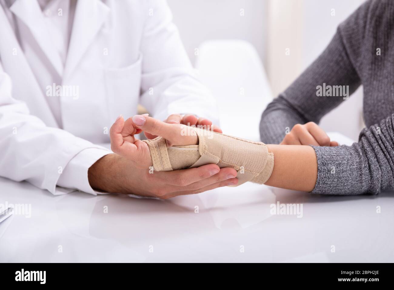Close-up Of Doctor's Hand Checking Fractured Hand Of A Woman Stock ...