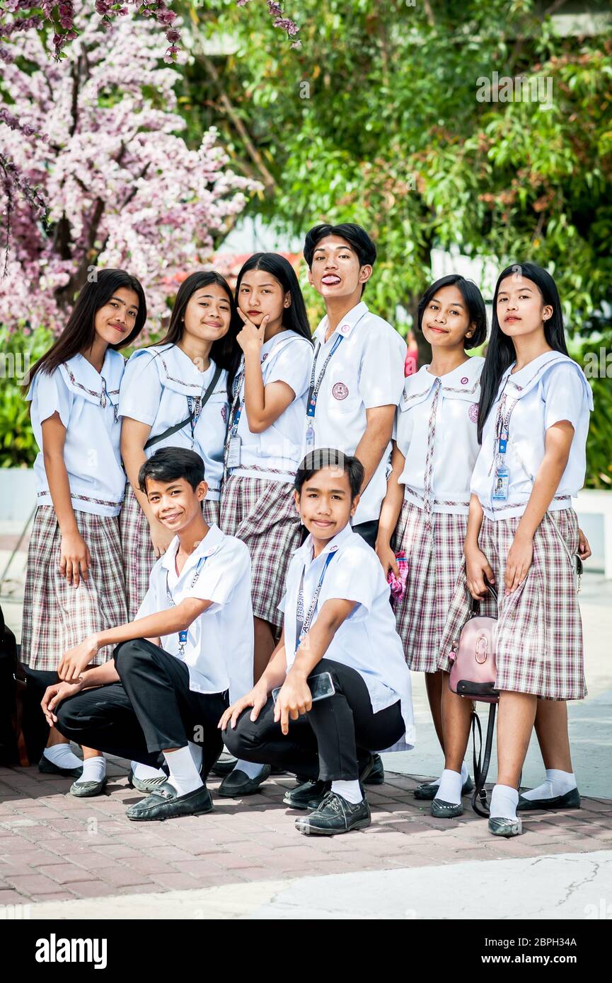 Playful Filipino school children pose in a park in Angeles City, The ...