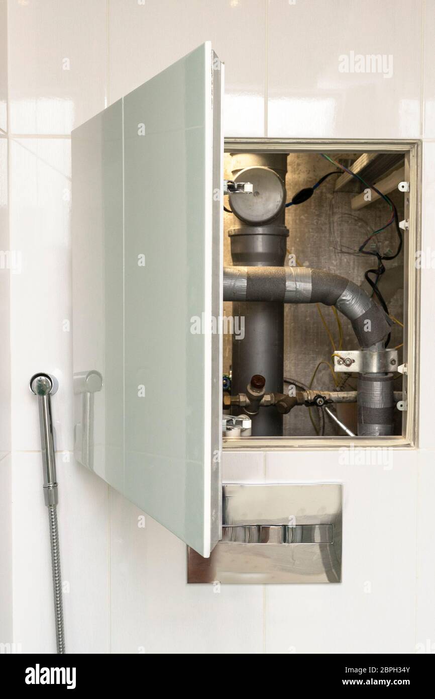 plumbing cabinet. the door is open and visible communications: water ...