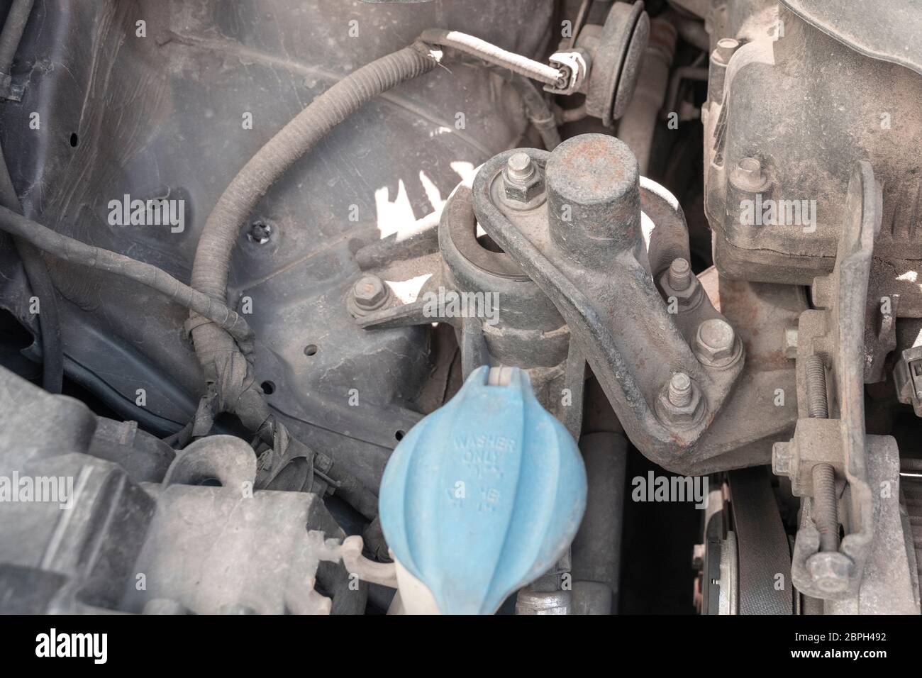 Auto mechanic works in the garage. Repair. Car generator Stock Photo ...