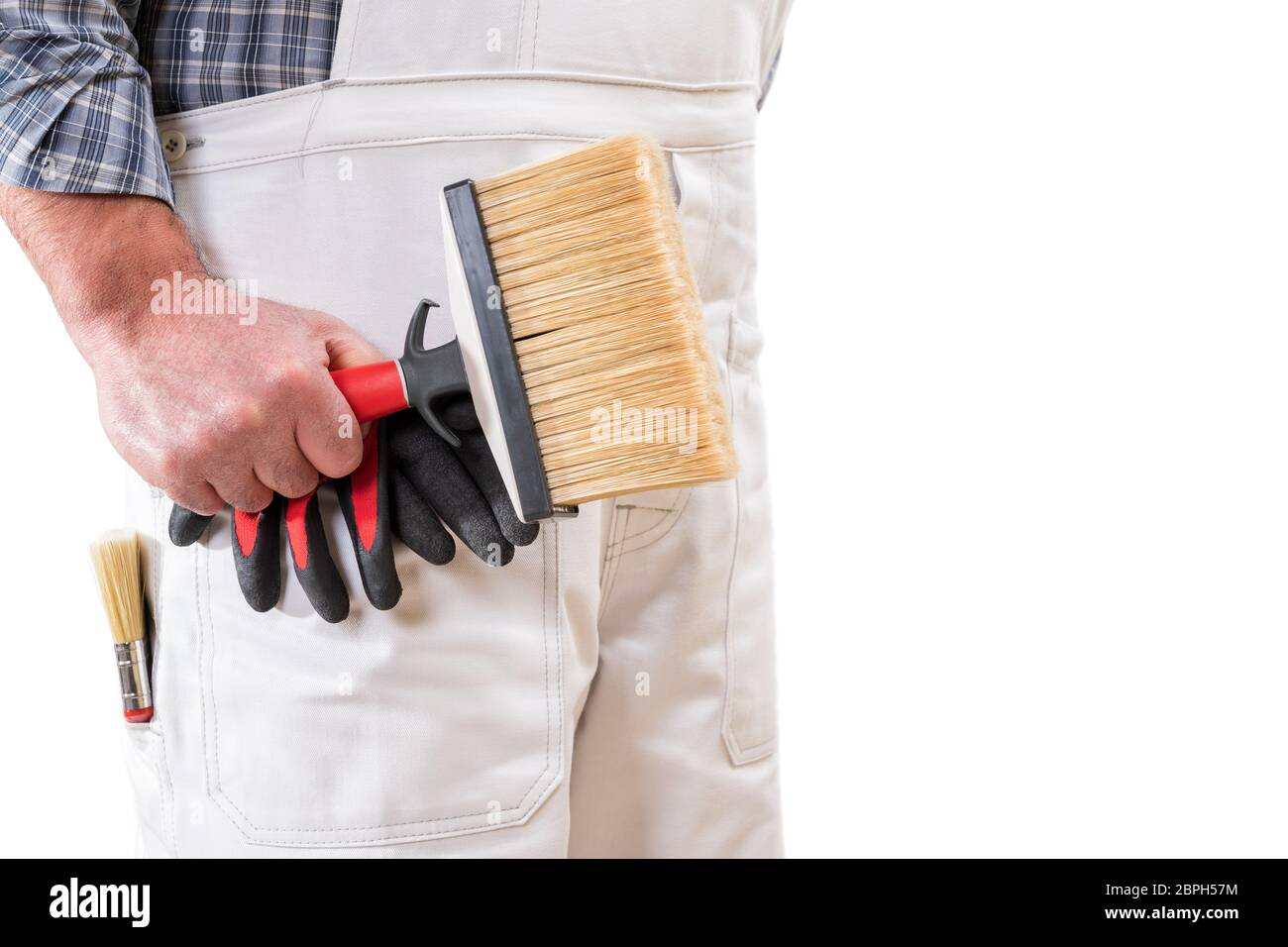 House painter worker with white work overalls, keeps the roller to ...