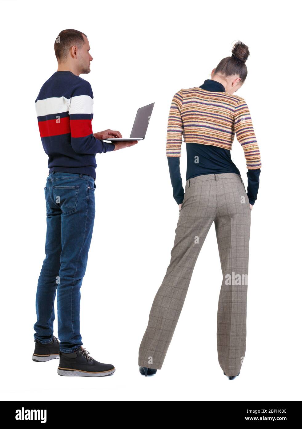 Back view couple with laptop in sweater. beautiful man and woman. Rear ...