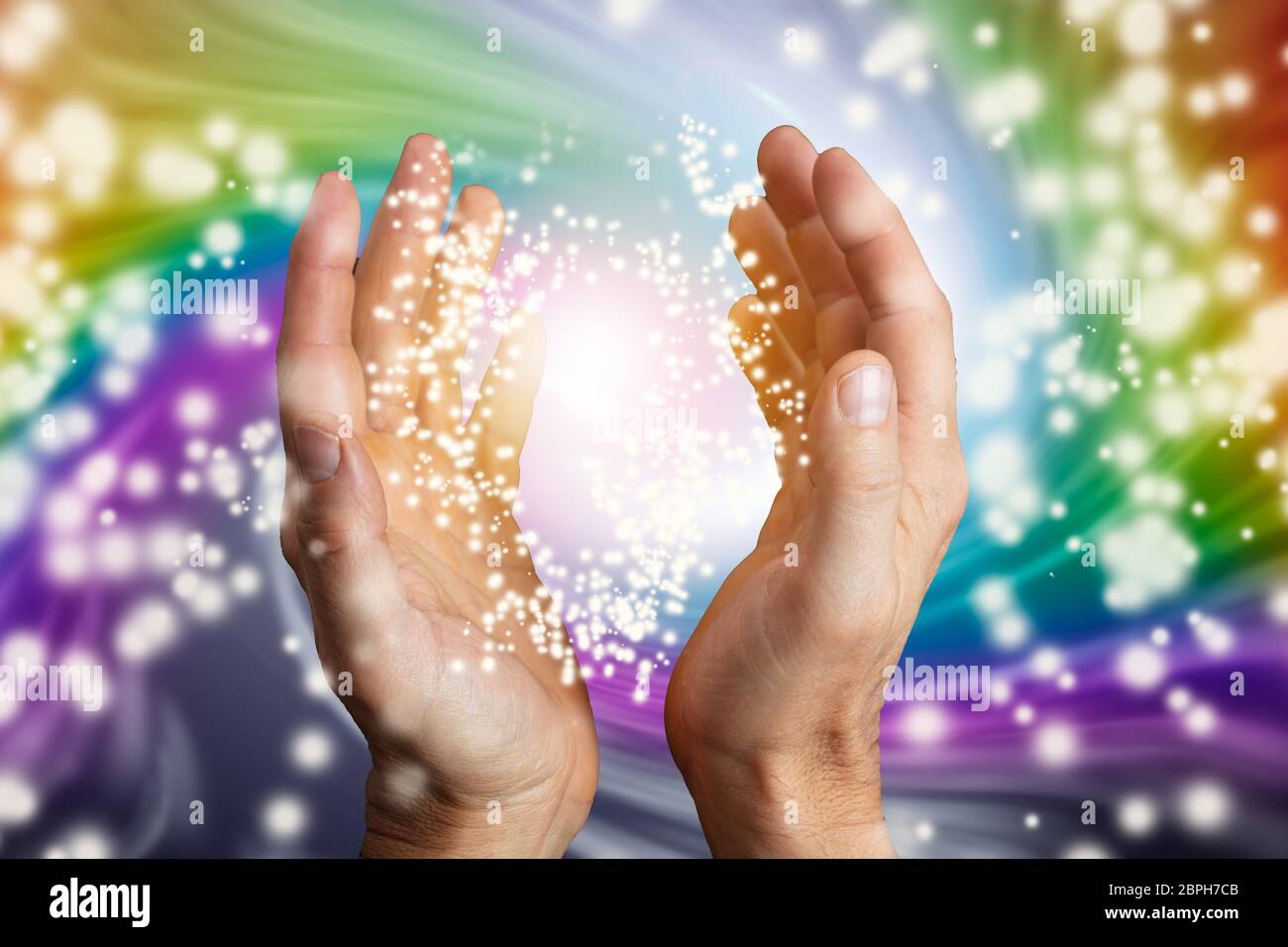 Close-up Of Mysterious Glowing Power In The Hands Stock Photo - Alamy