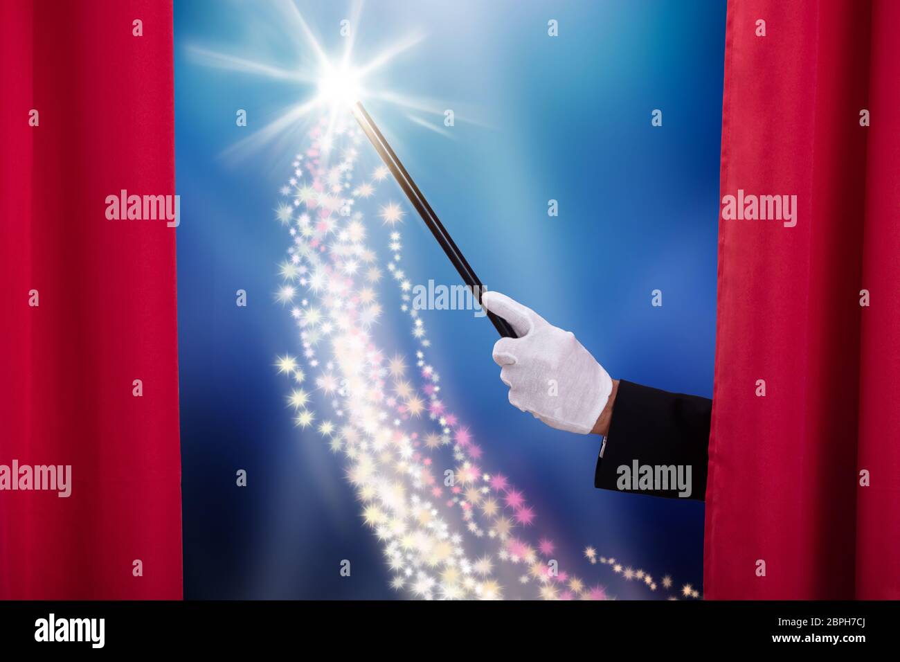 Hand holding magic wand hi-res stock photography and images - Alamy