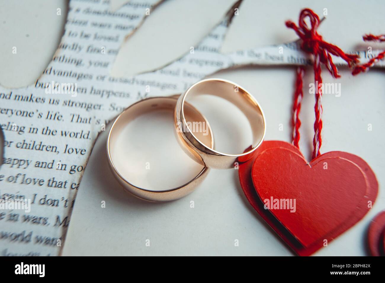 wedding ring on paper hearts decoration Stock Photo - Alamy