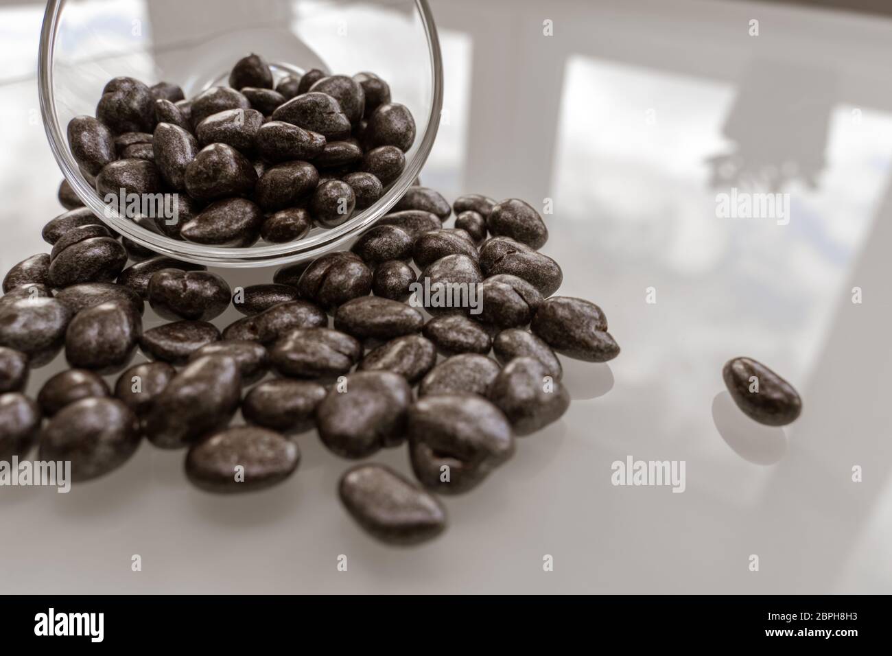 raisin sweets in chocolate closeup. uneven marble coating Stock Photo ...