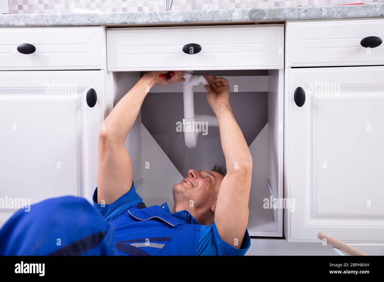 Professional plumber install pipes sink hi-res stock photography and ...