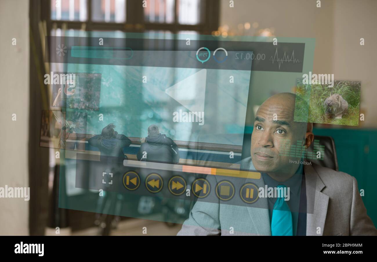 Professional watching streaming media on a futuristic video screen ...