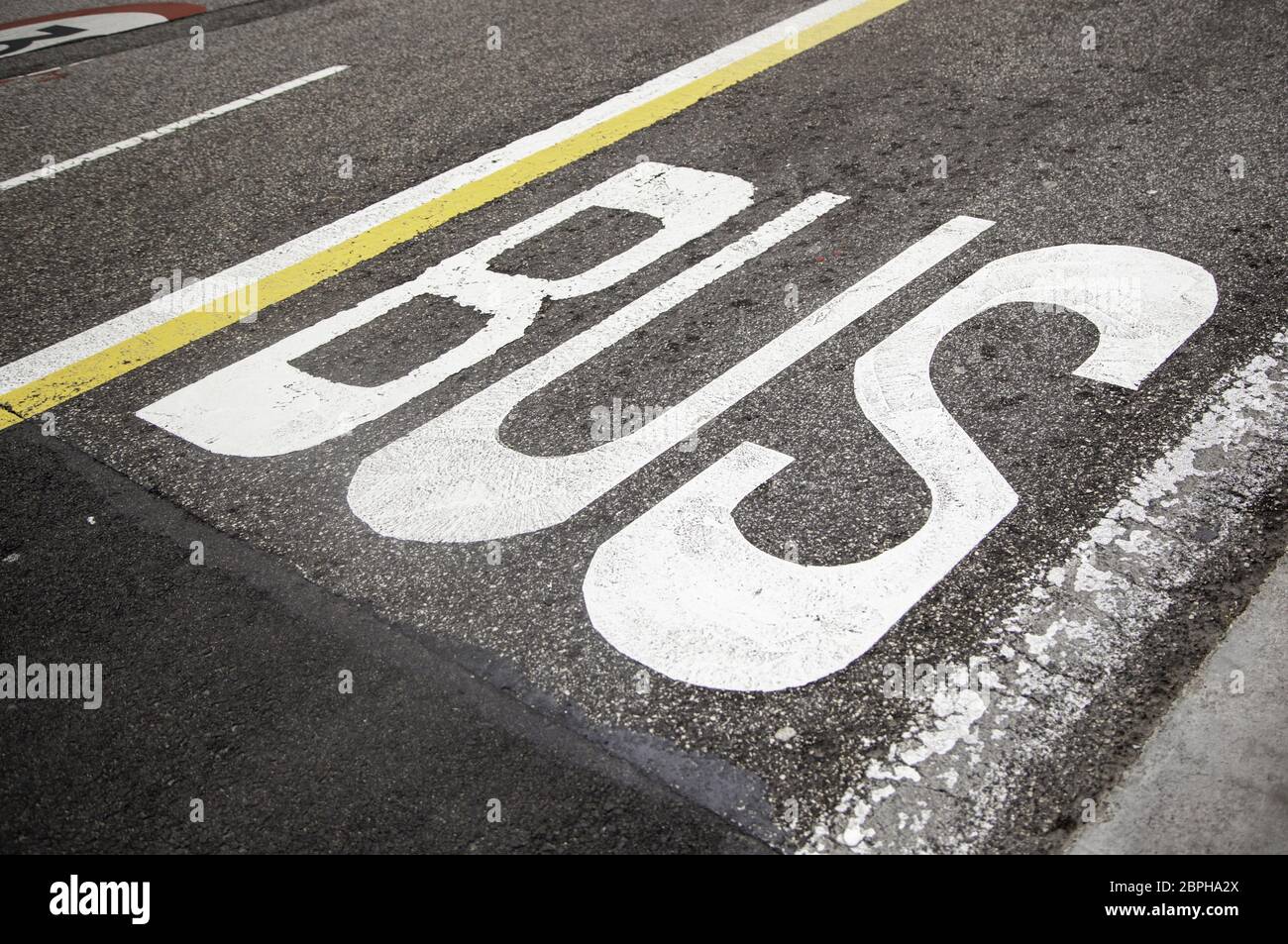 Bus signal on the asphalt, traffic signal detail Stock Photo - Alamy