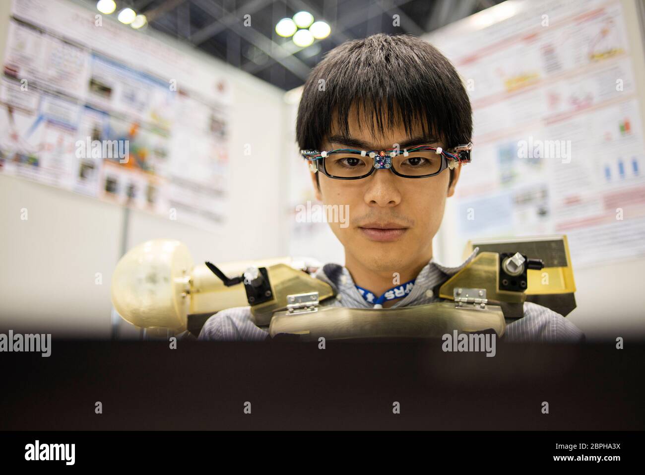 An assisting robot is demonstrated during the Japan Robot Week ...